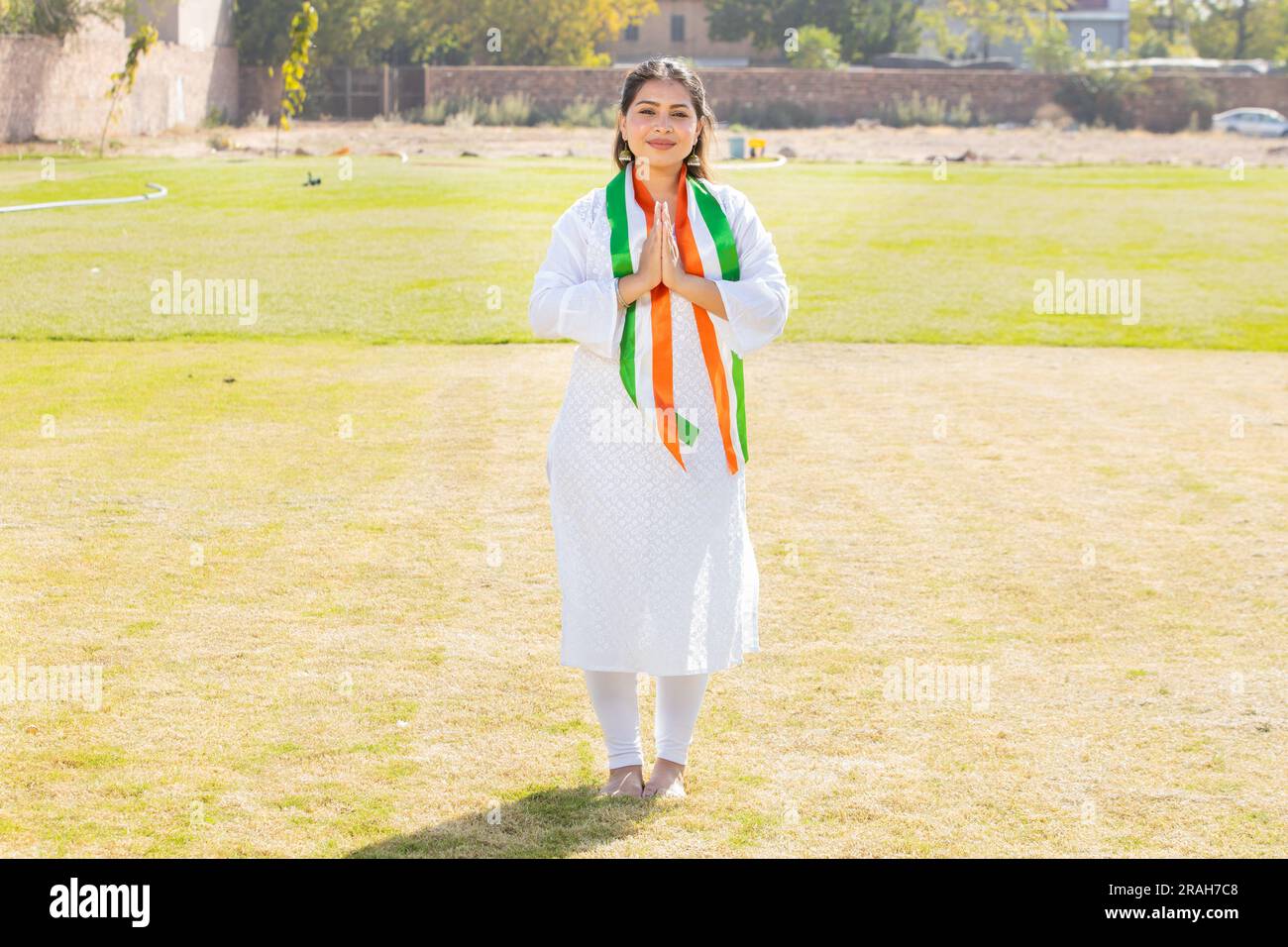 Portrait of young indian woman wearing traditional white kurta and ...