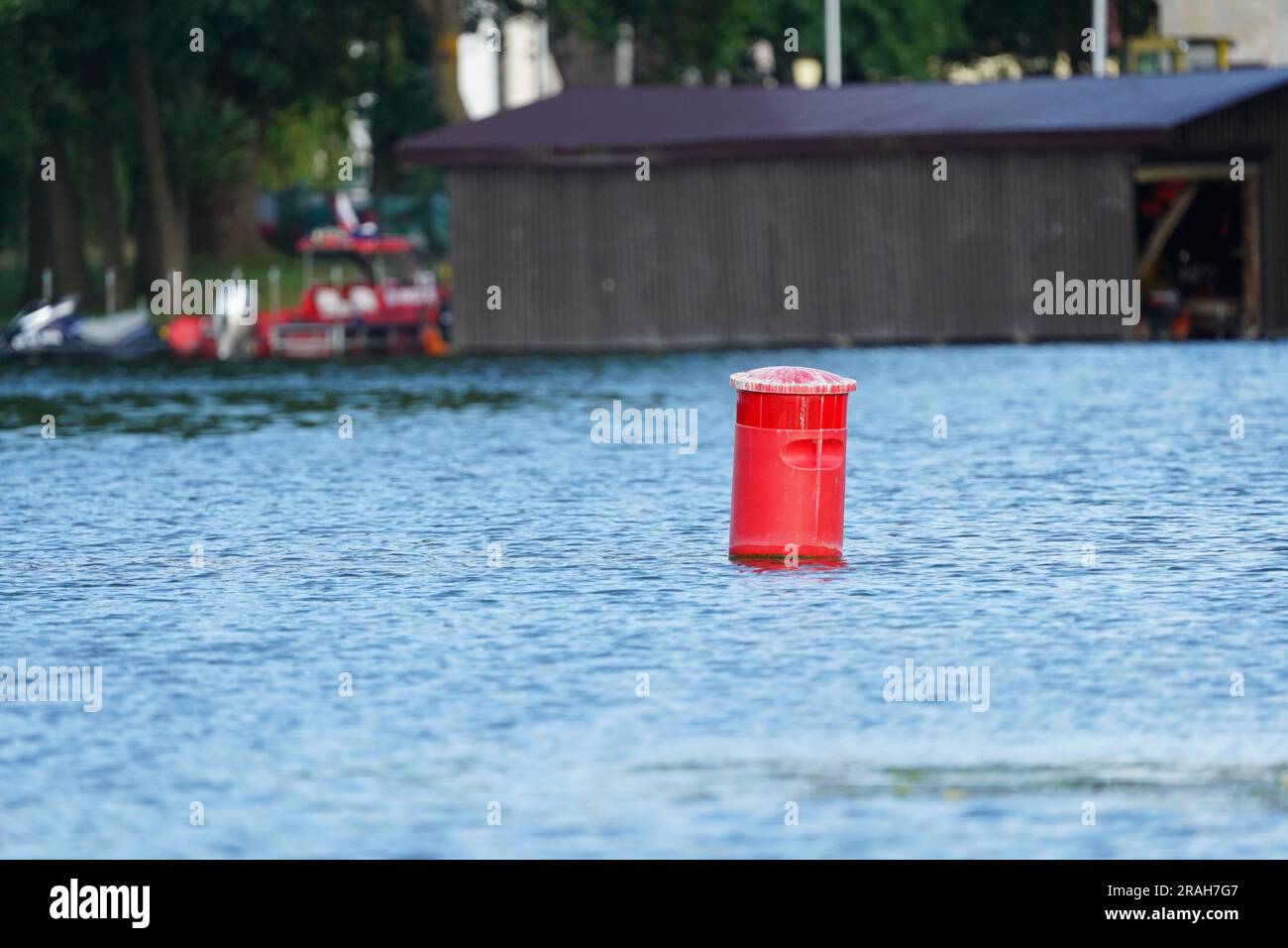 Red buoy in the harbour. Red sign in the docking area Stock Photo - Alamy