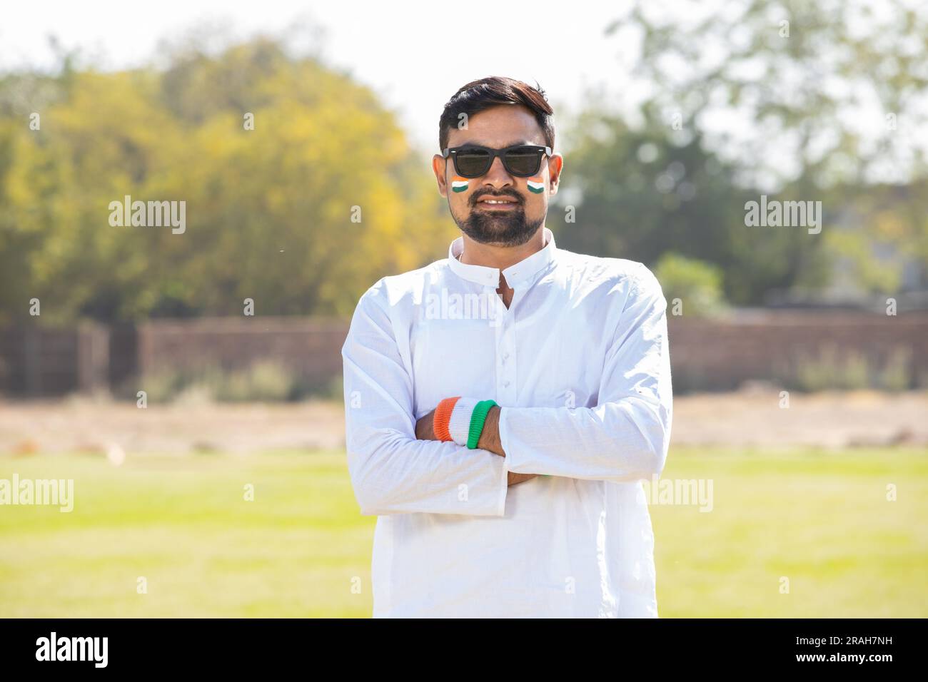 Portrait of young indian man wearing traditional white dress and ...