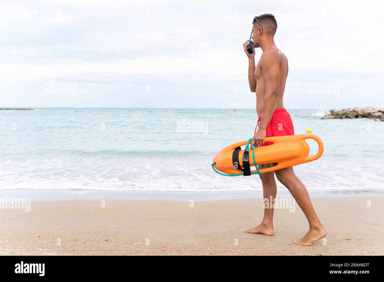Photo with copy space of a strong lifeguard on duty on the beach Stock ...