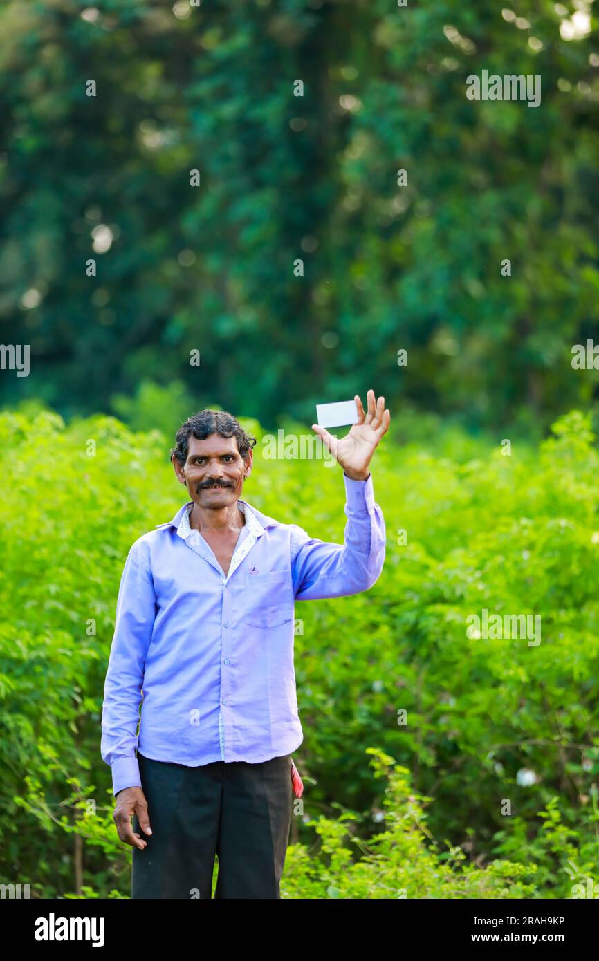 Indian farmer holding ATM card , happy farmer Stock Photo - Alamy
