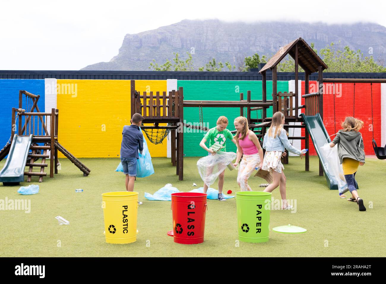 Group of caucasian schoolchildren collecting rubbish for recycling in ...