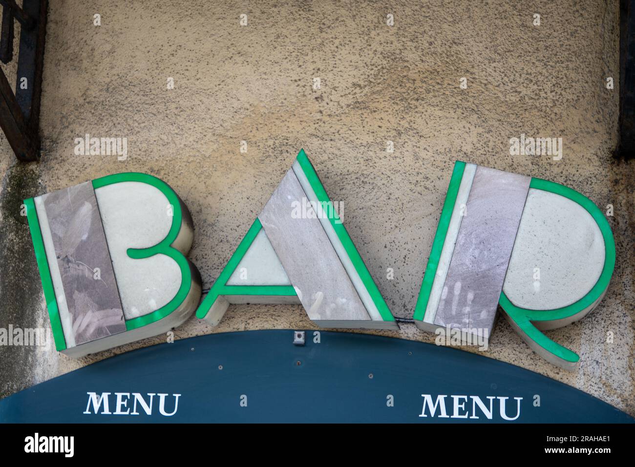 text bar menu on facade wall front building entrance cafe pub in street ...