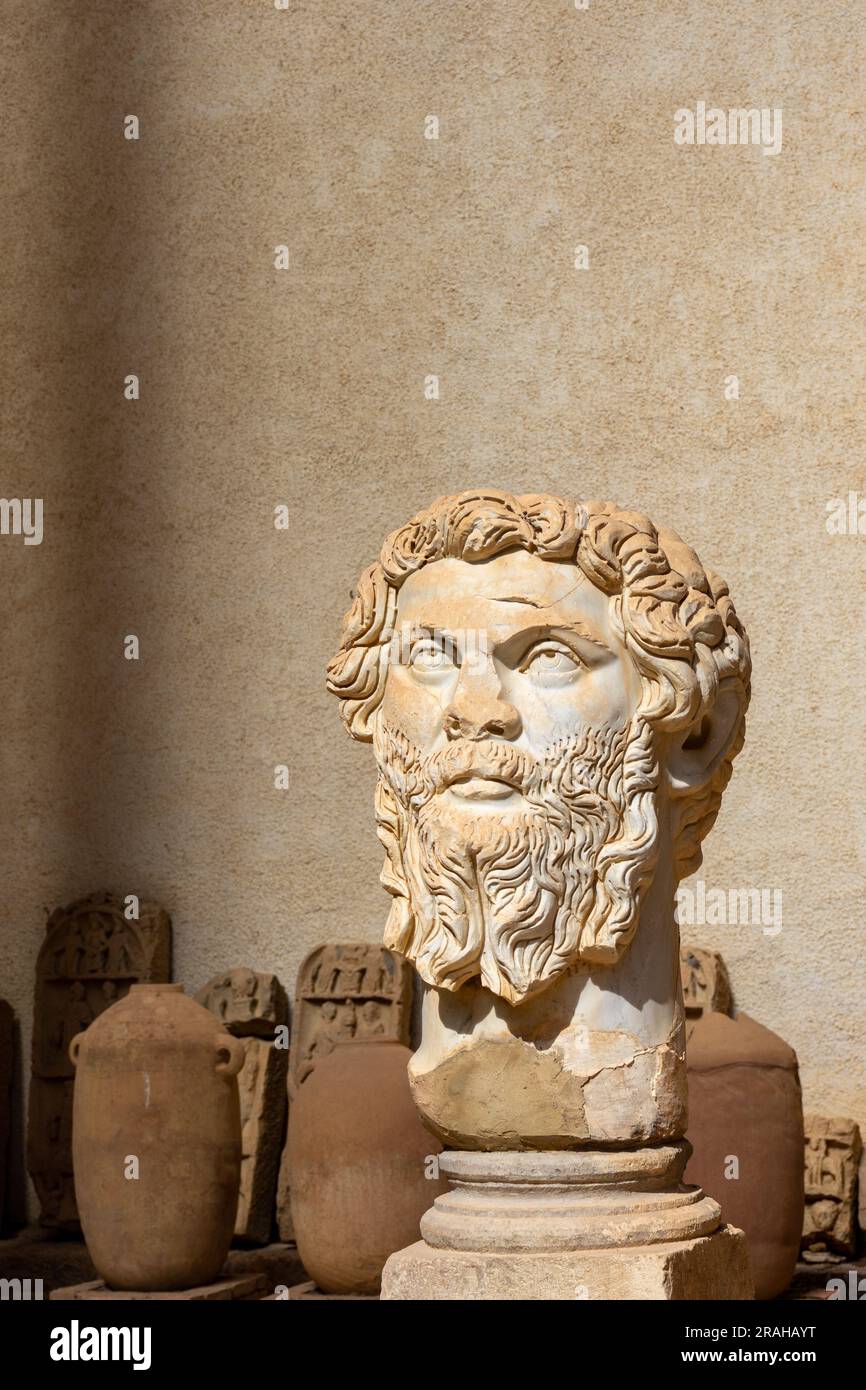 Close-up Ancient giant head statue of a Roman emperor in the Cuicul ...