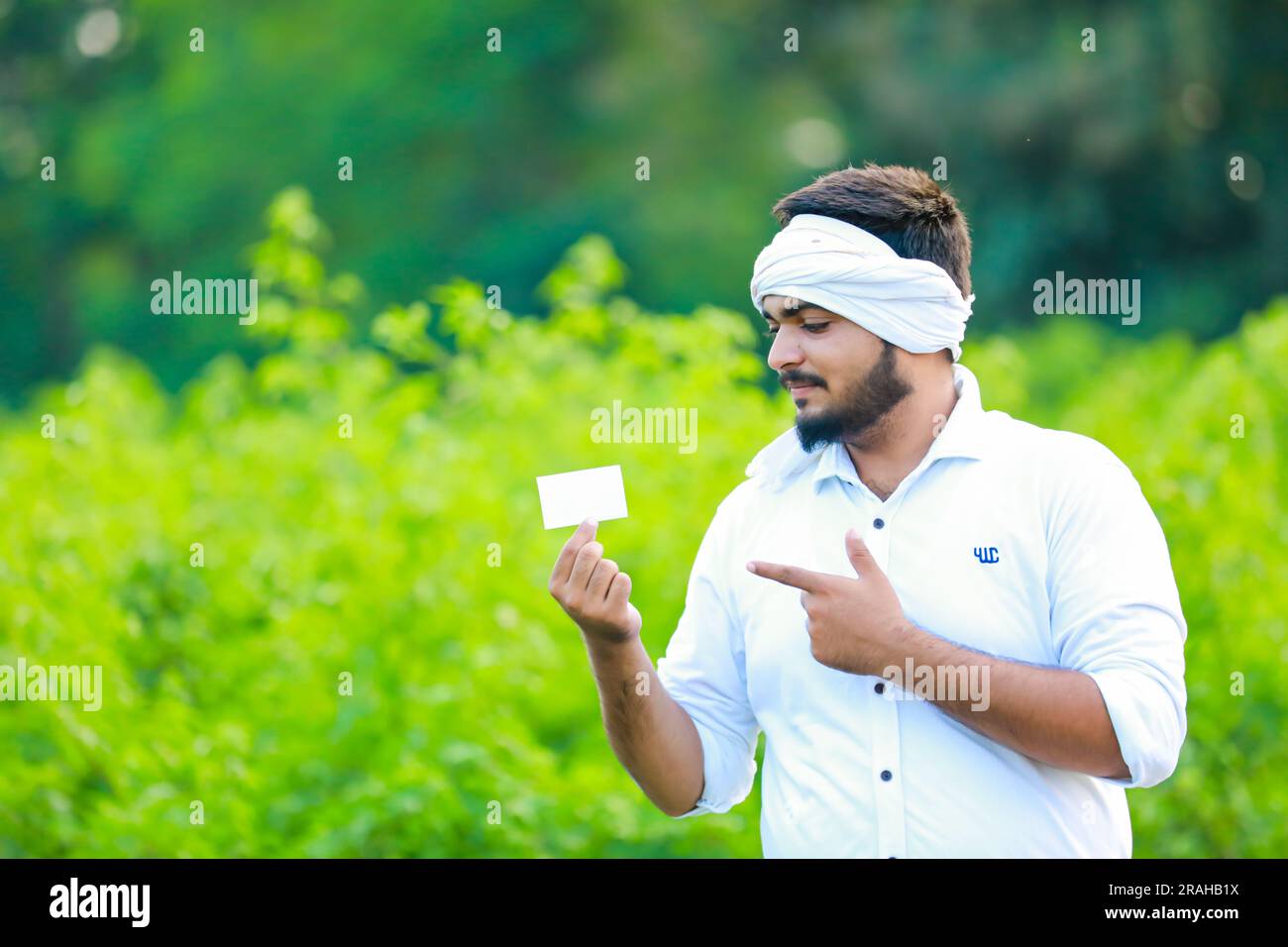 Indian farmer holding ATM card , happy farmer Stock Photo - Alamy