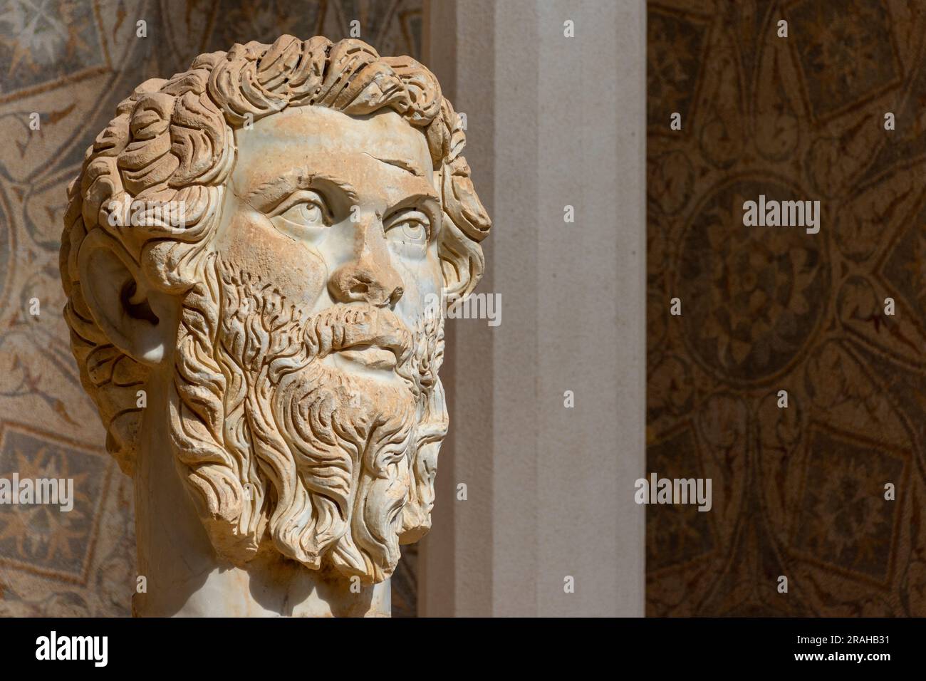 Close-up Ancient giant head statue of a Roman emperor in the Cuicul ...
