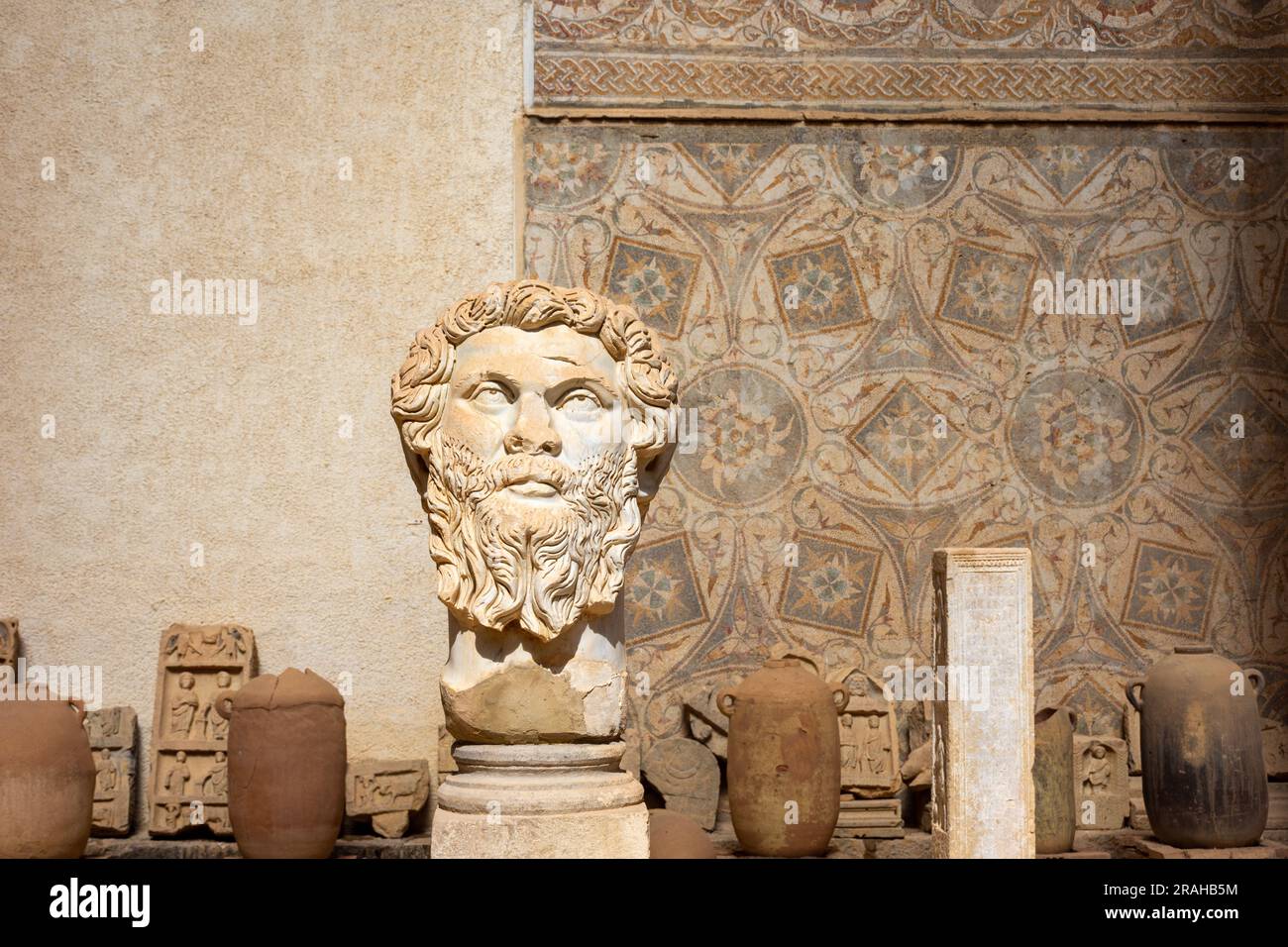 Close-up Ancient giant head statue of a Roman emperor in the Cuicul ...