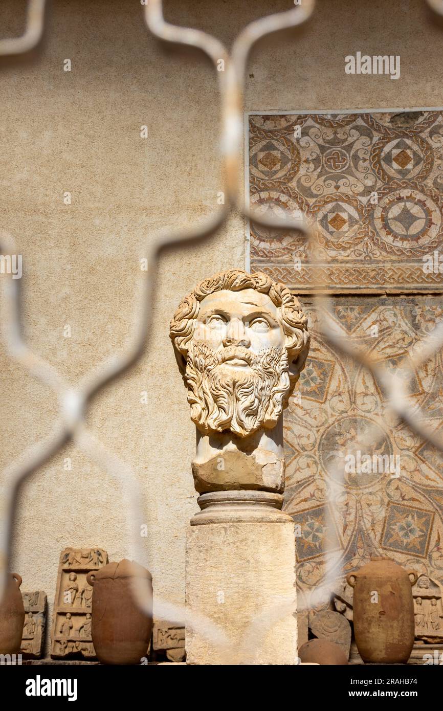 Close-up Ancient giant head statue of a Roman emperor in the Cuicul ...