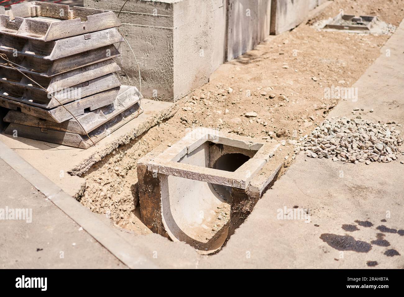 Laying concrete manholes and drain pipes for stormwater system ...