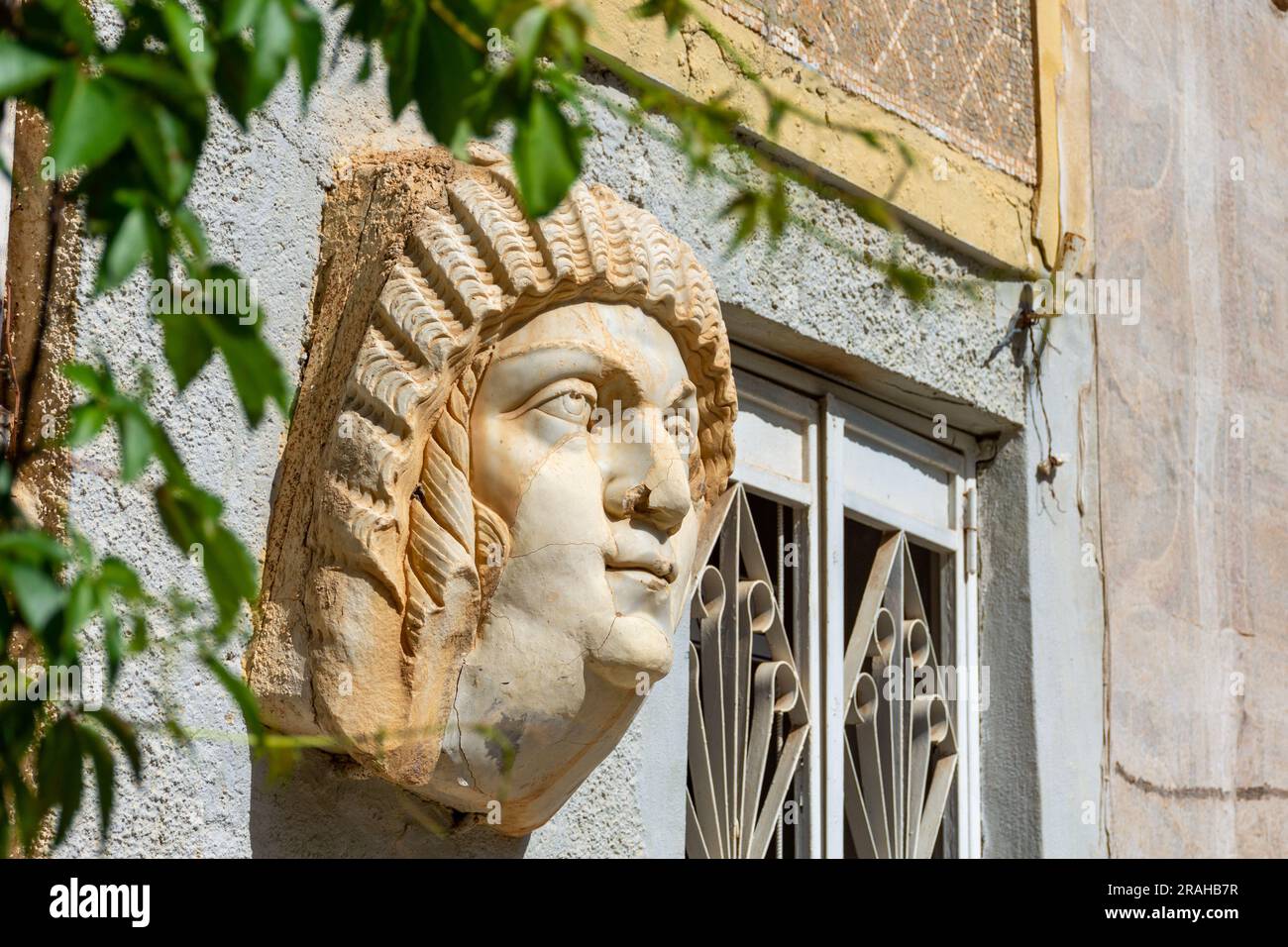 Close-up Ancient giant head statue of a Roman emperor on the Cuicul ...