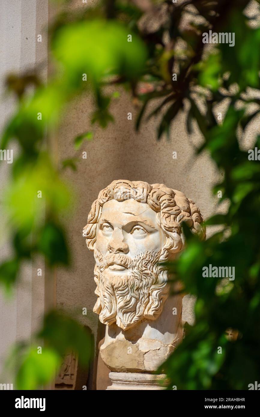 Close-up Ancient giant head statue of a Roman emperor in the Cuicul ...