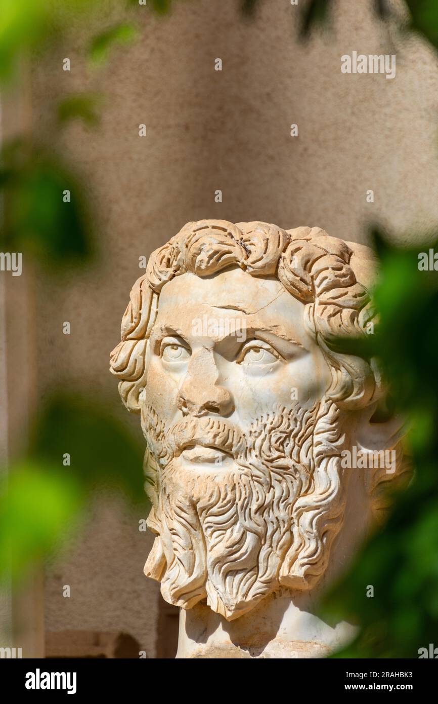 Close-up Ancient giant head statue of a Roman emperor in the Cuicul ...