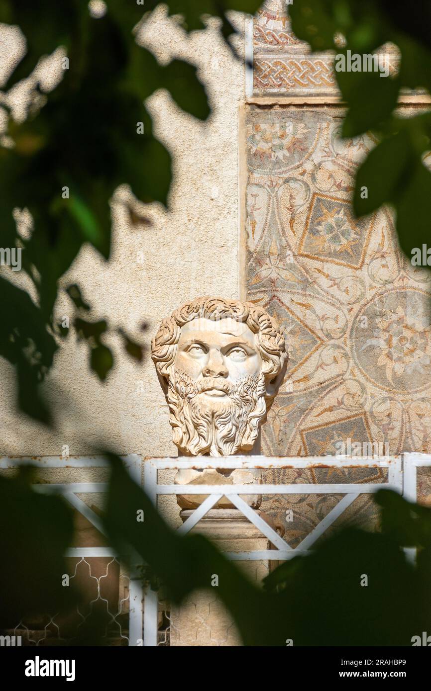 Close-up Ancient giant head statue of a Roman emperor in the Cuicul ...