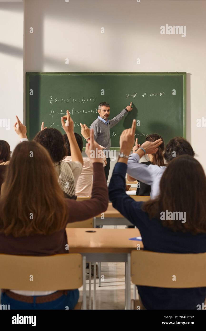 Math teacher giving lessons. Classroom with students. School education ...