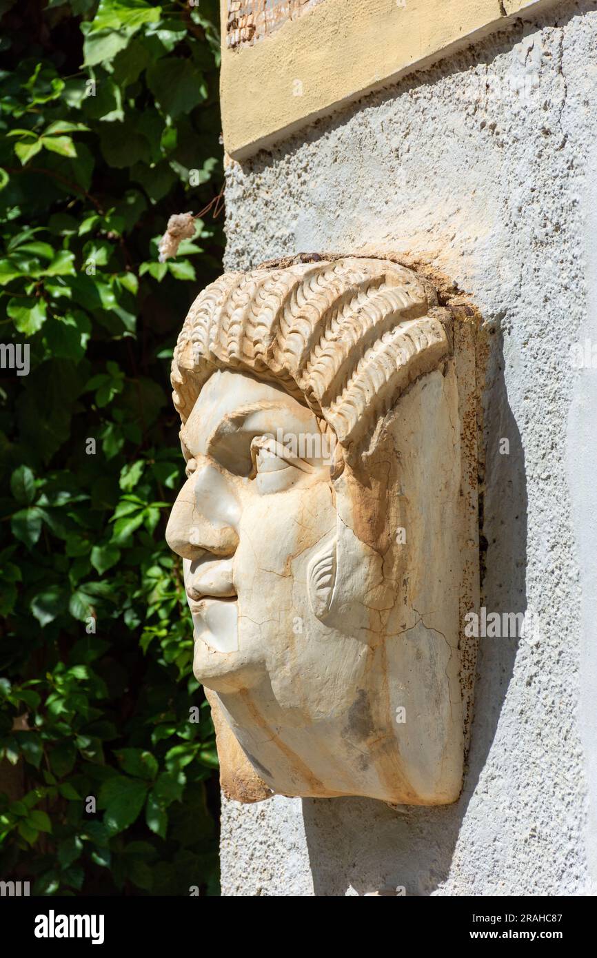Close-up Ancient giant head statue of a Roman emperor on the Cuicul ...
