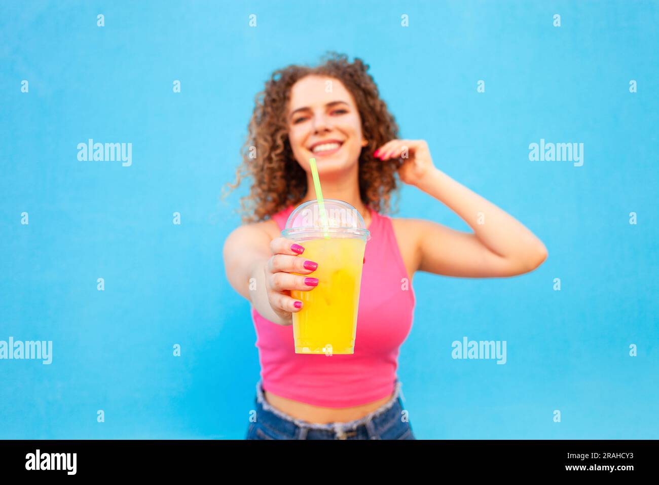 Beautiful happy woman with orange cold juice, concept summer drinks ...