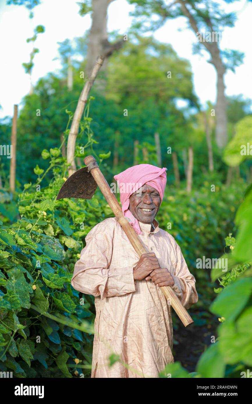 Indian farming happy farmer holding piggy bank in farm, poor farmer ...