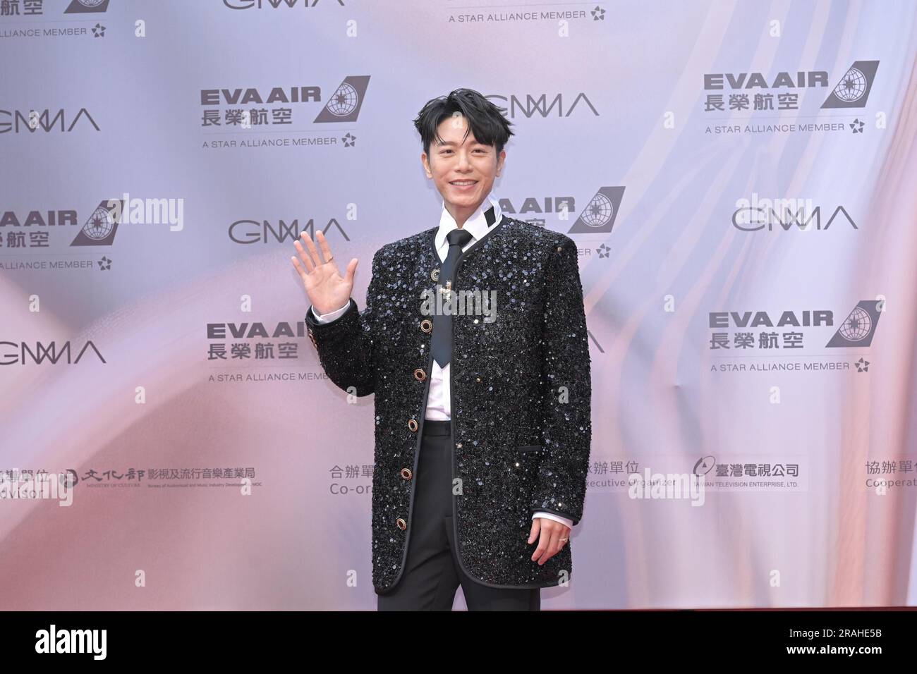 Taiwanese Mandopop and folk-rock singer-songwriter William Wei poses for photos on the red ...