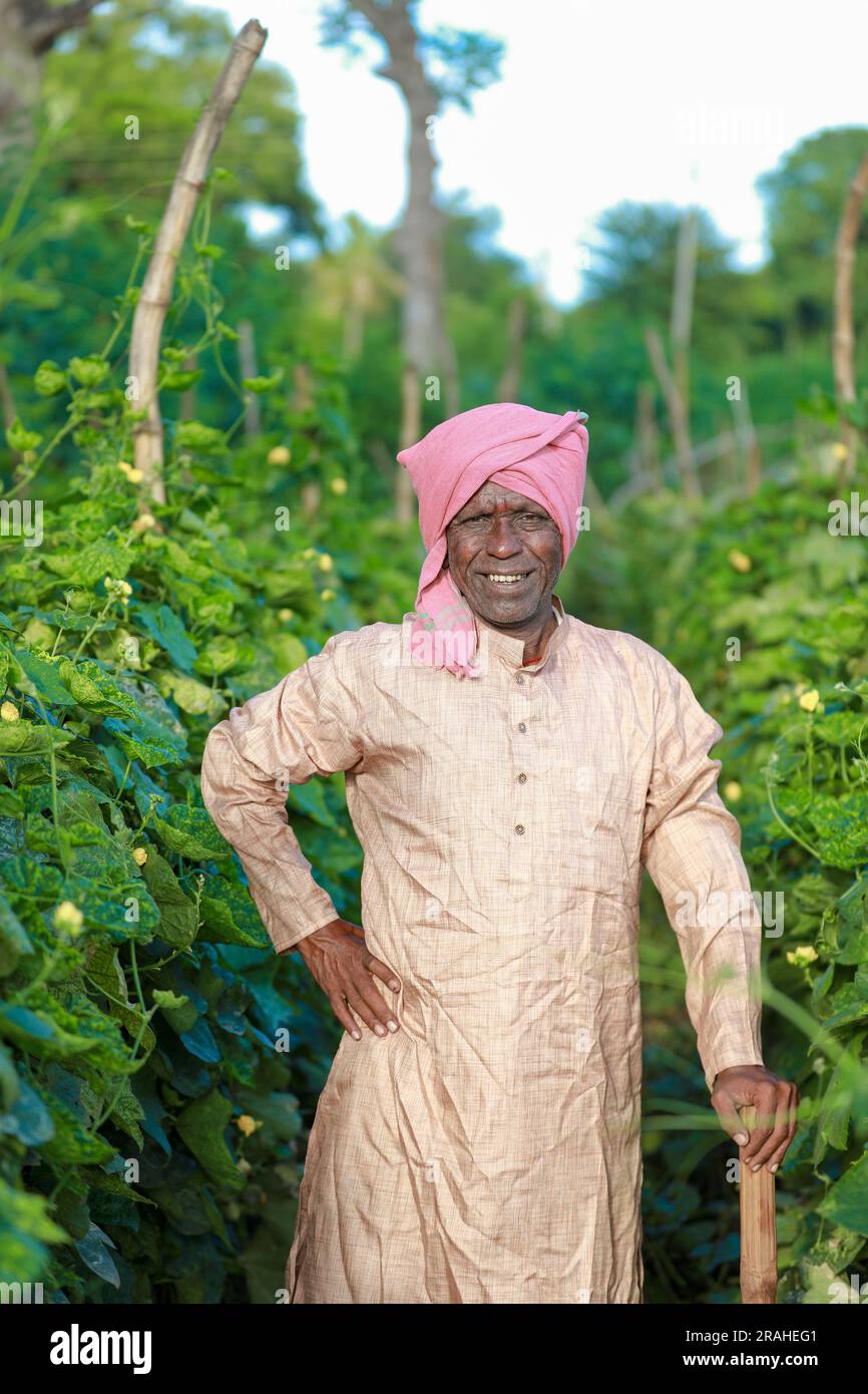 Indian farming Happy indian farmer standing in farm, sowing Empty Hands ...