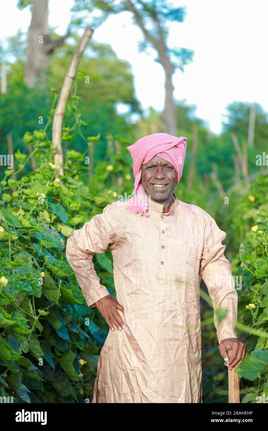Indian farming Happy indian farmer standing in farm, sowing Empty Hands ...