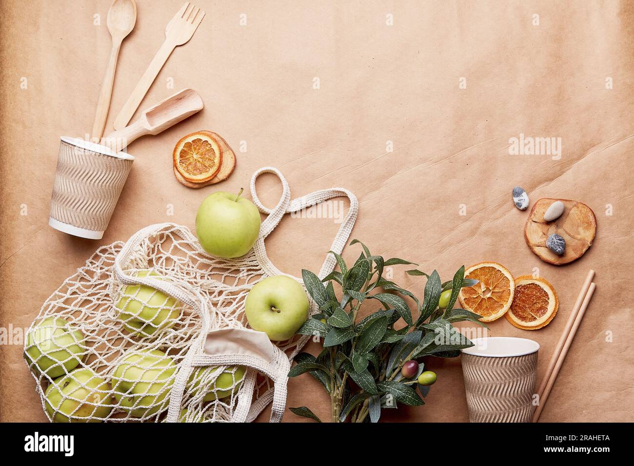 Natural craft paper background complete wooden cutlery, cardboard cups ...