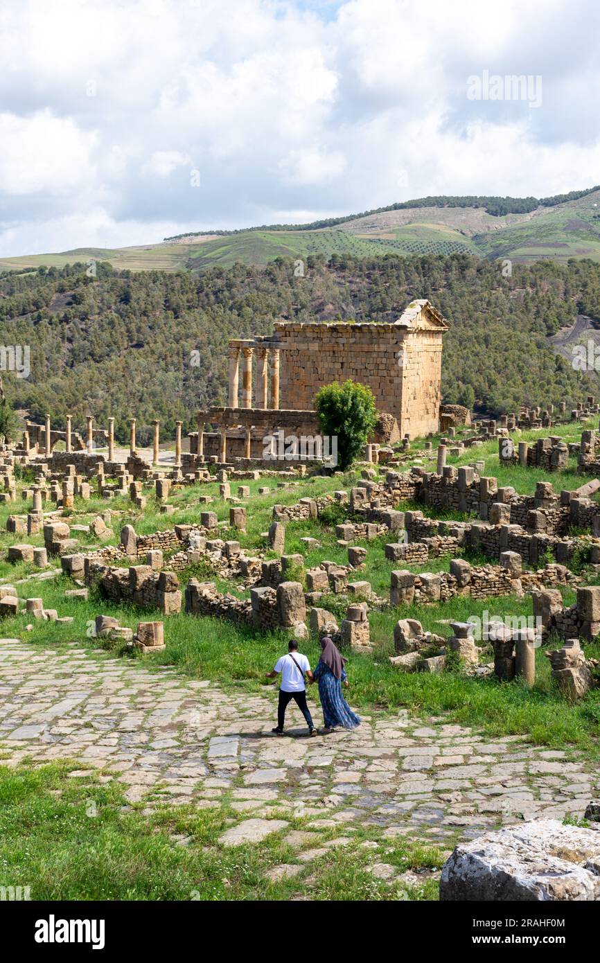 Algerian couple walking in the ancient Roman town of Cuicul. UNESCO ...