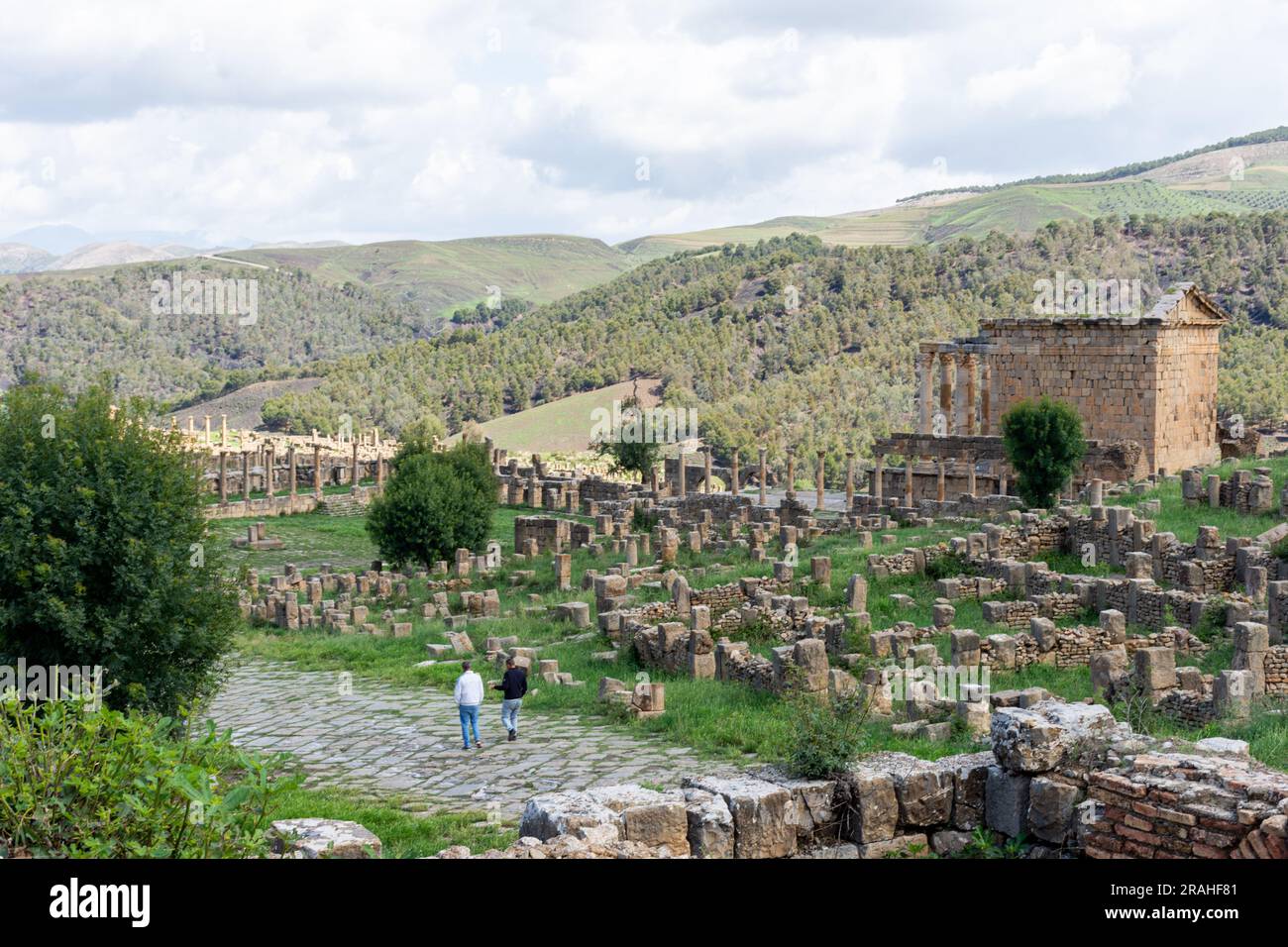 Tourists walking in the ancient Roman town of Cuicul. UNESCO world ...