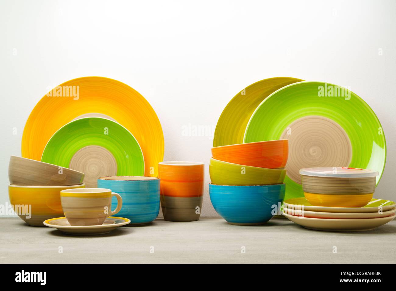 Set of colored ceramic dishware front view Stock Photo - Alamy