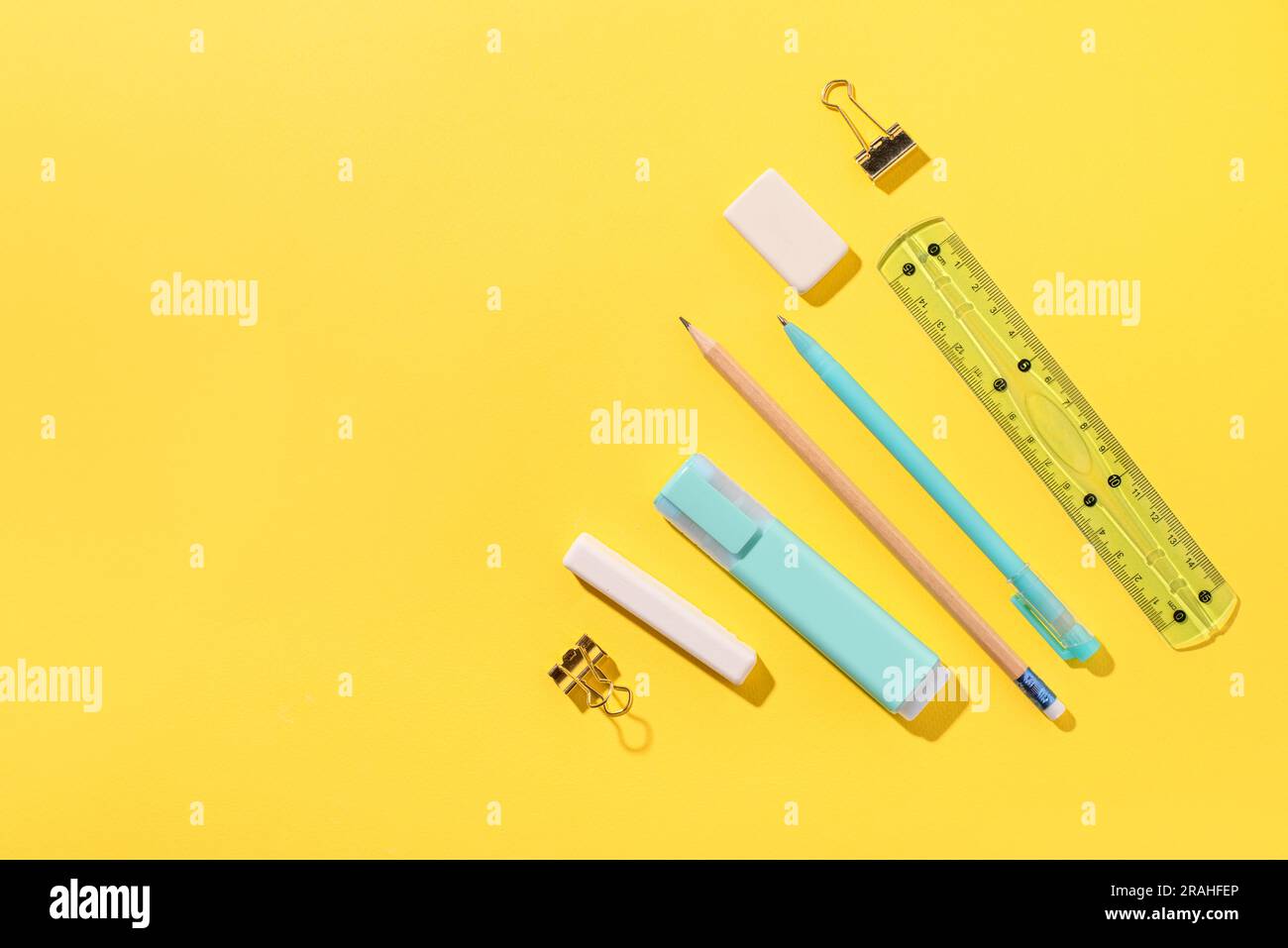 School supplies on yellow background Stock Photo - Alamy