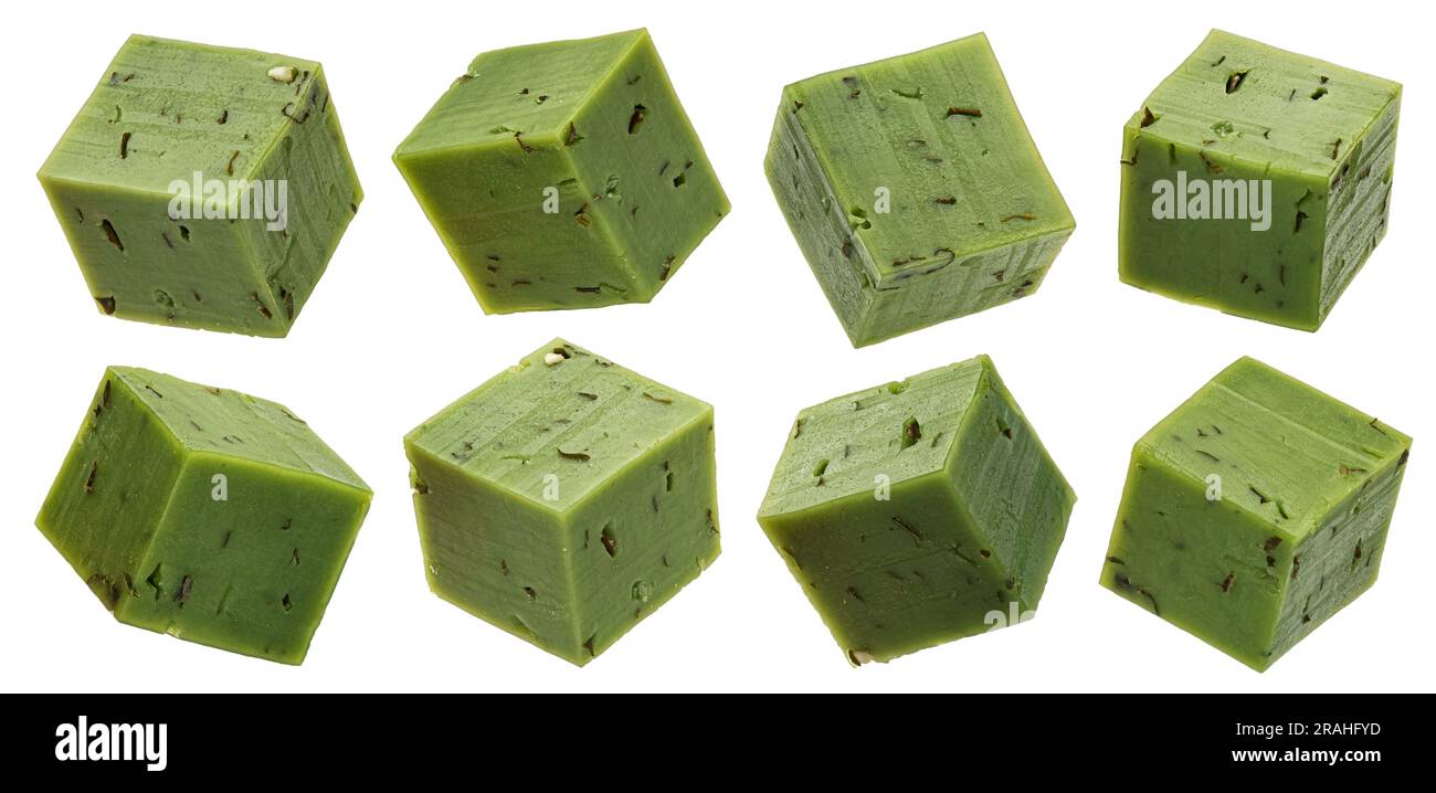 Green cheese pesto cubes isolated on white background Stock Photo - Alamy