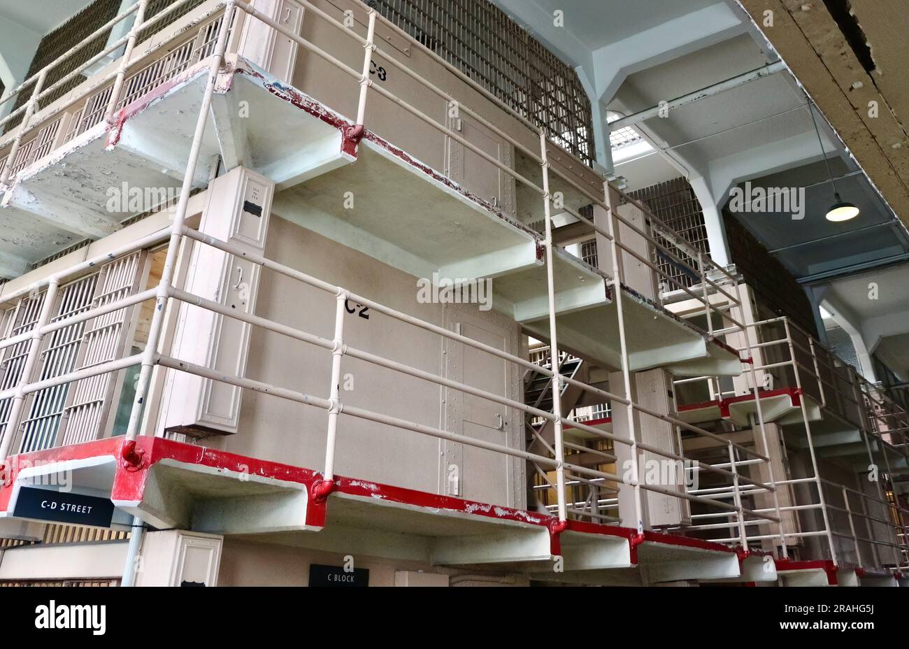 Inside Alcatraz Federal penitentiary looking up at corridors with ...
