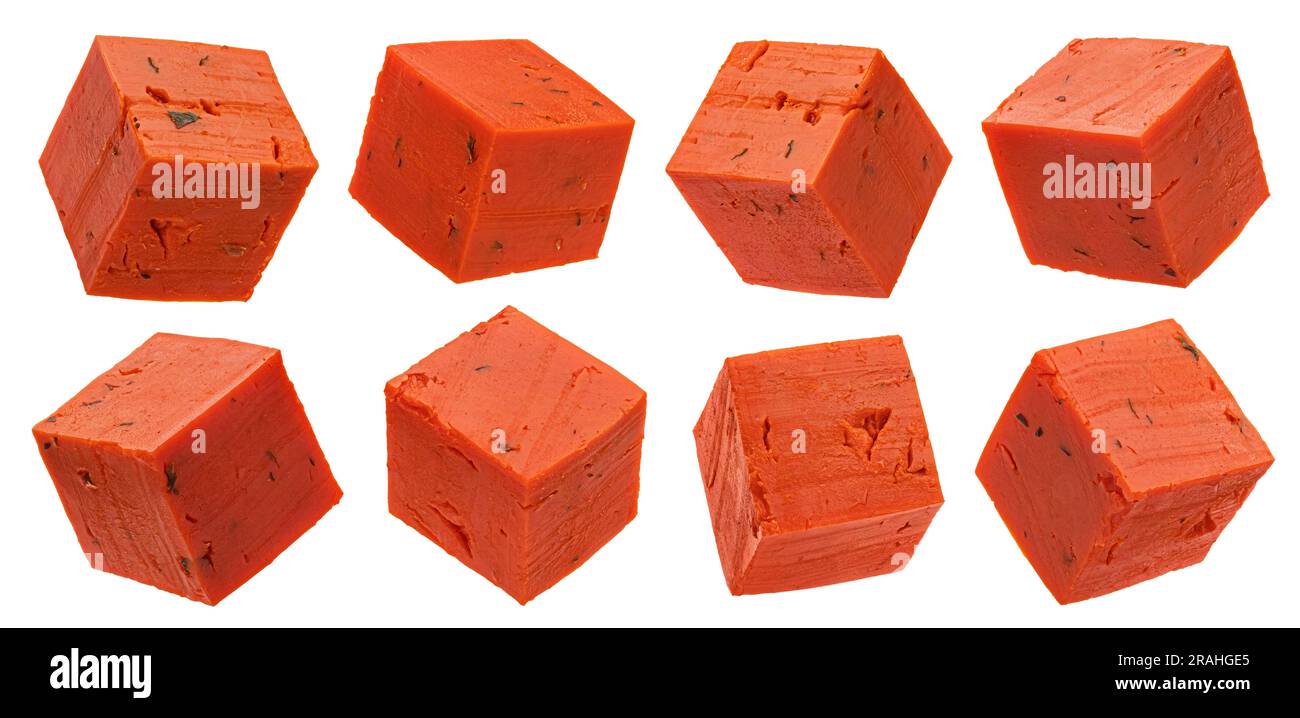 Red cheese pesto cubes isolated on white background Stock Photo - Alamy