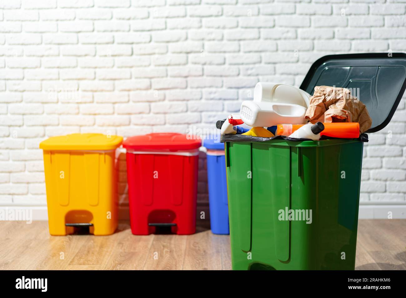 Trash cans full of waste in the building Stock Photo - Alamy