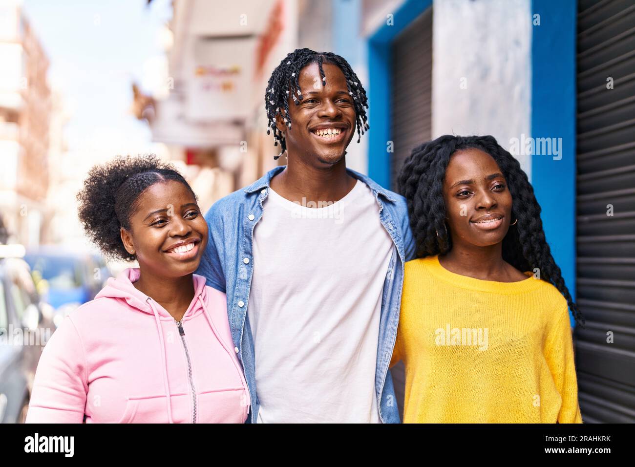African american friends smiling confident standing together at street ...