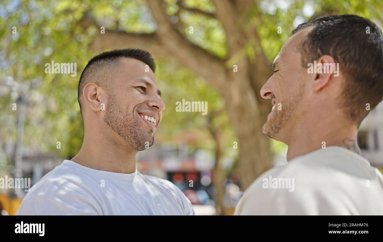 Two men couple smiling confident standing together at park Stock Photo ...