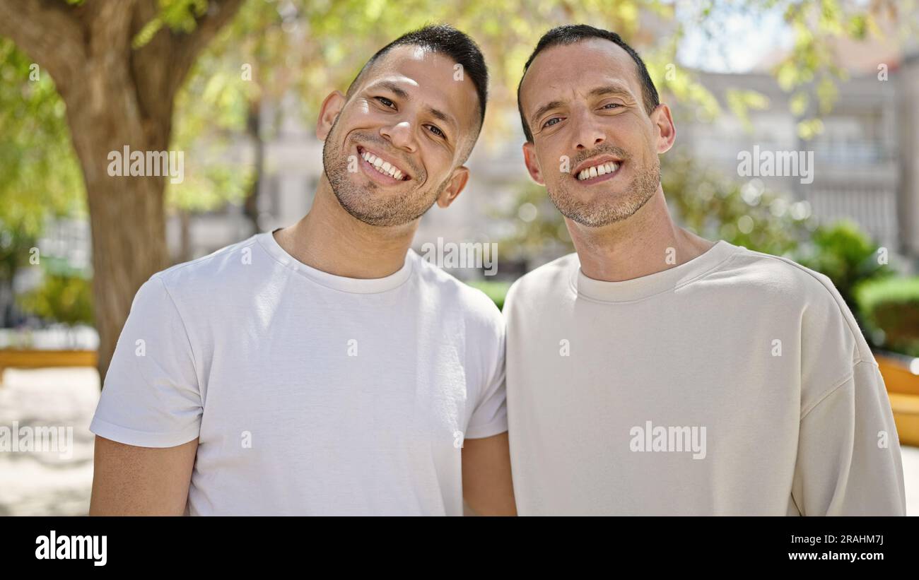 Two men couple smiling confident standing together at park Stock Photo ...