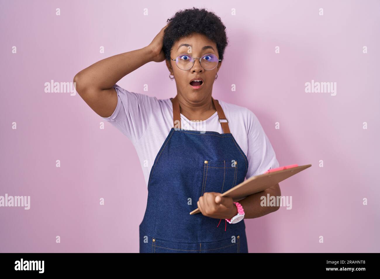 Young african american woman wearing professional waitress apron ...