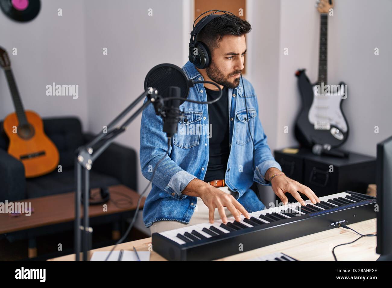 Young composer listening music in hi-res stock photography and images ...