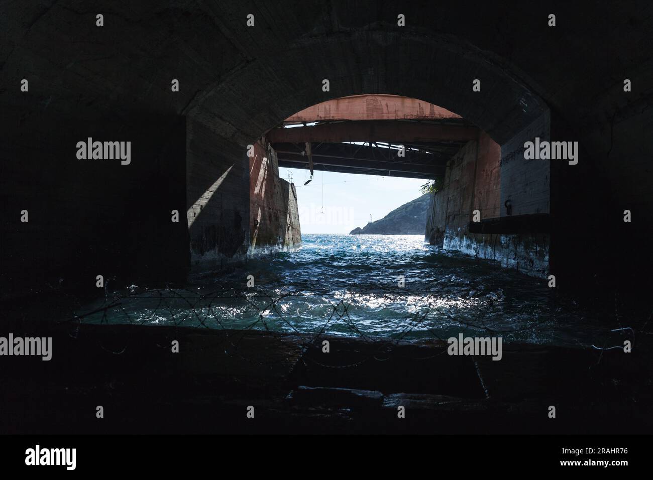 Entrance gate of concrete tunnel, part of abandoned underground ...