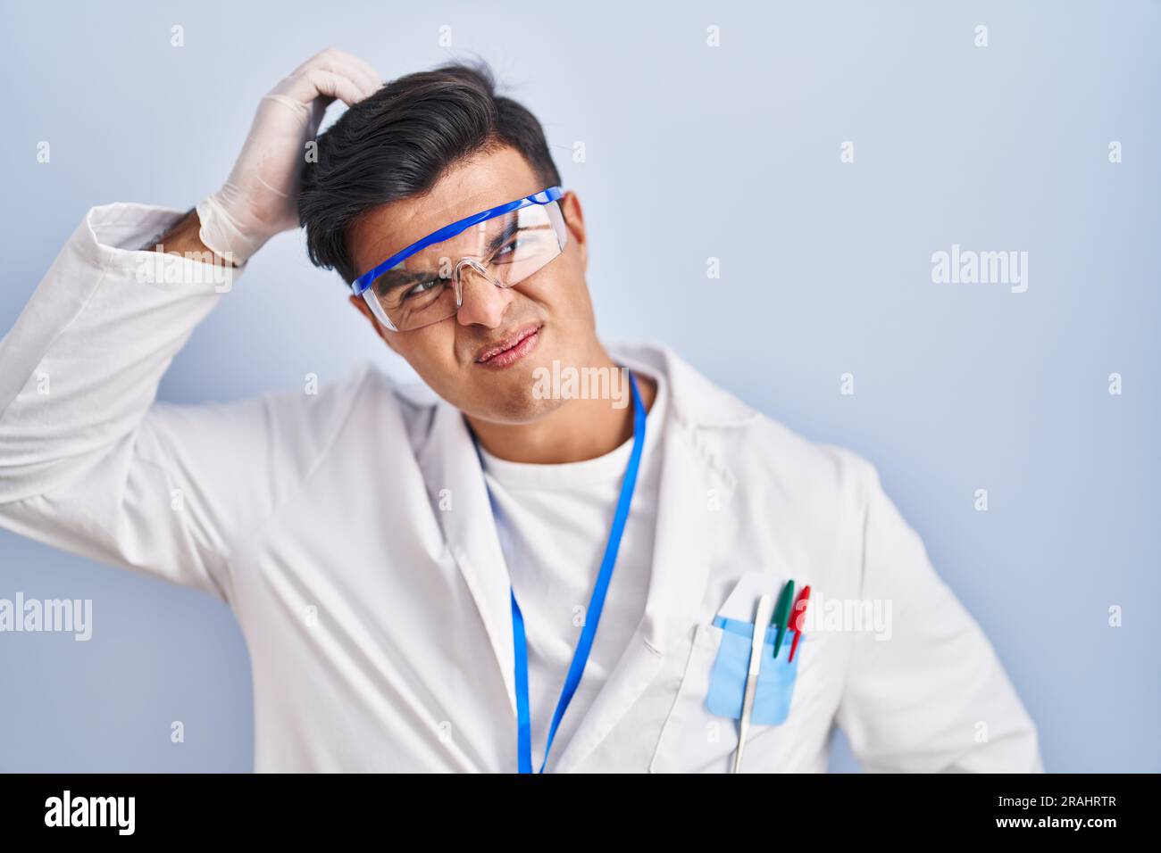 Hispanic man working as scientist confuse and wonder about question ...