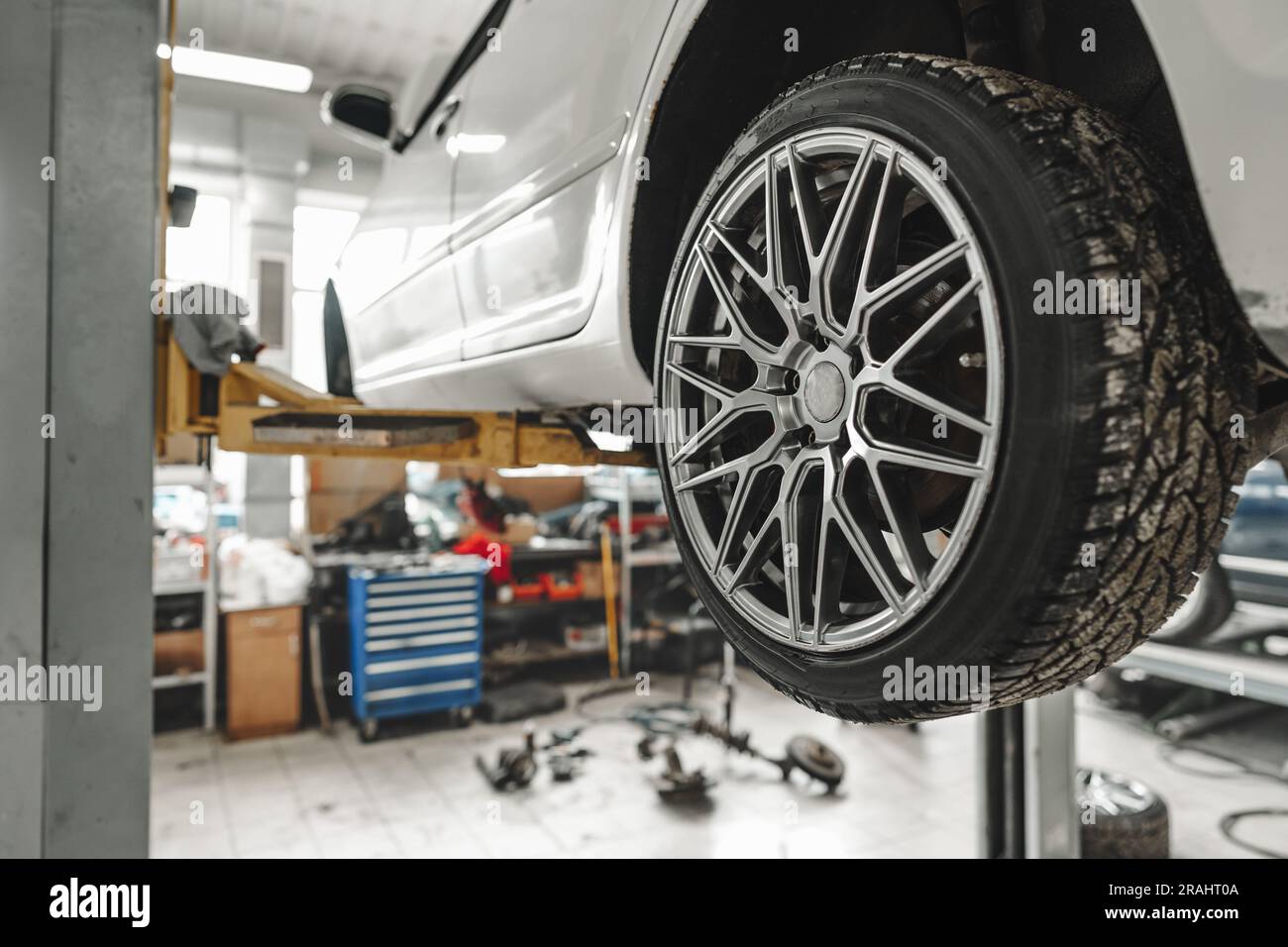Car on hoist at repair shop automobile hi-res stock photography and ...