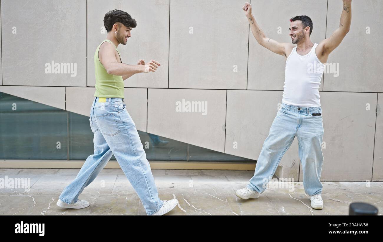 Happy gay couple dancing hi-res stock photography and images - Alamy