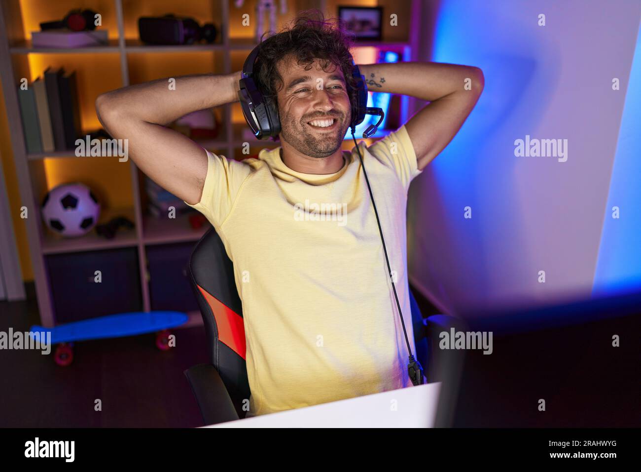 Young hispanic man streamer smiling confident relaxed with hands on ...