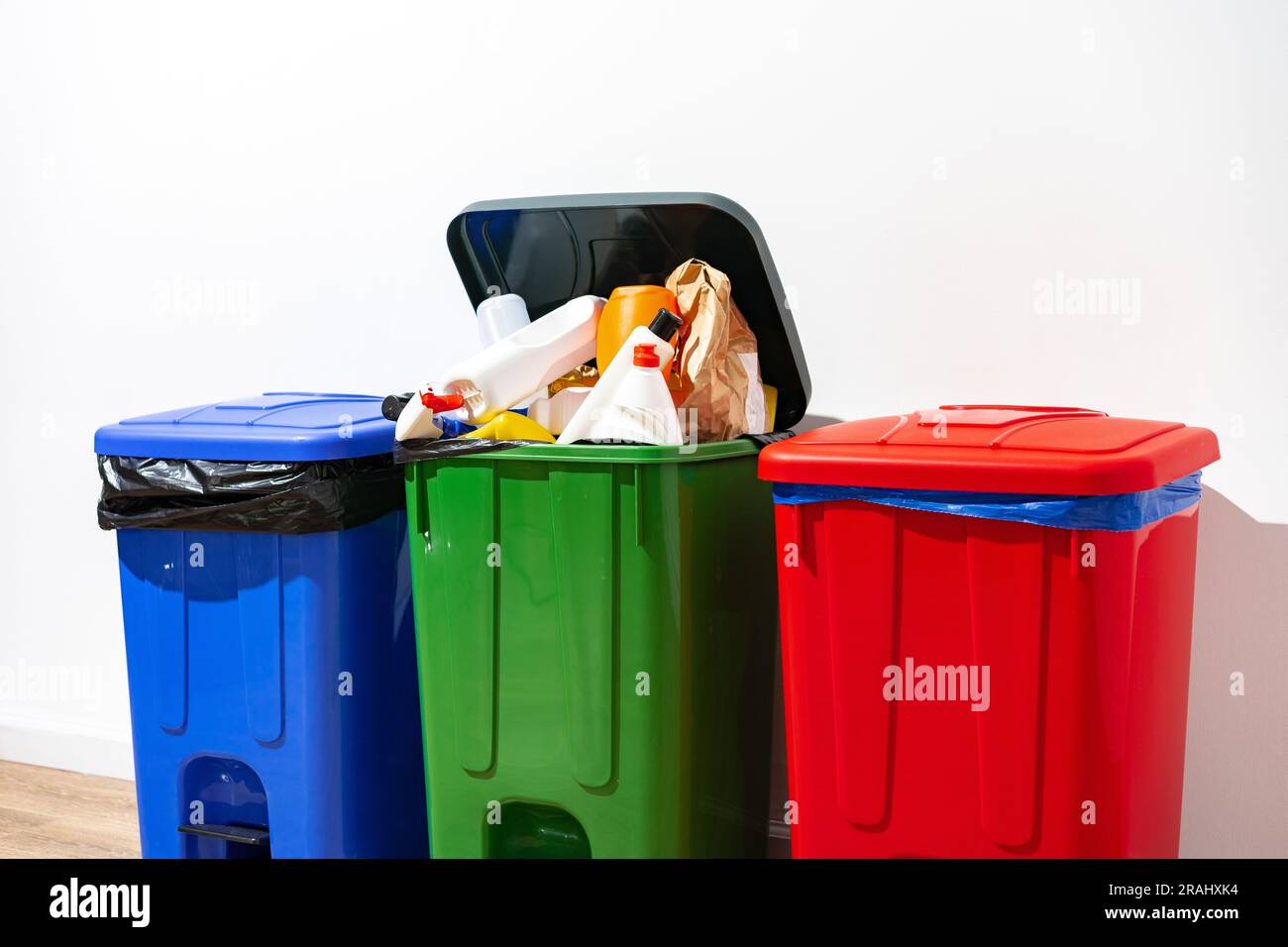Trash cans full of waste in the building Stock Photo - Alamy