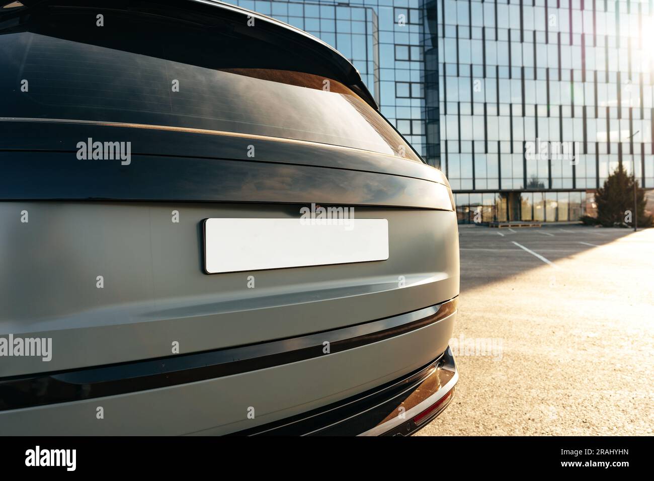 Rear side view of new luxury car Stock Photo - Alamy