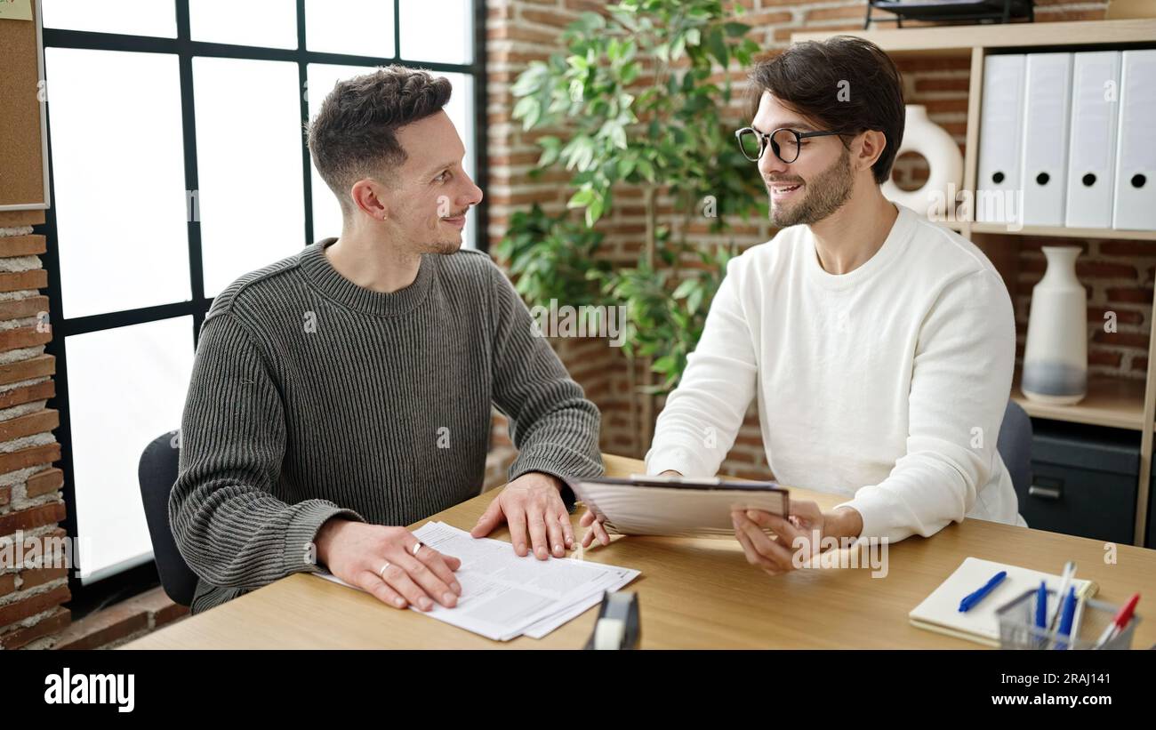 Two men business partners reading hi-res stock photography and images ...