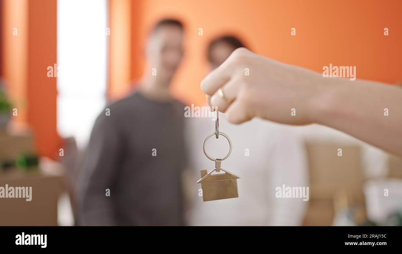 Two men couple looking keys at new home Stock Photo - Alamy