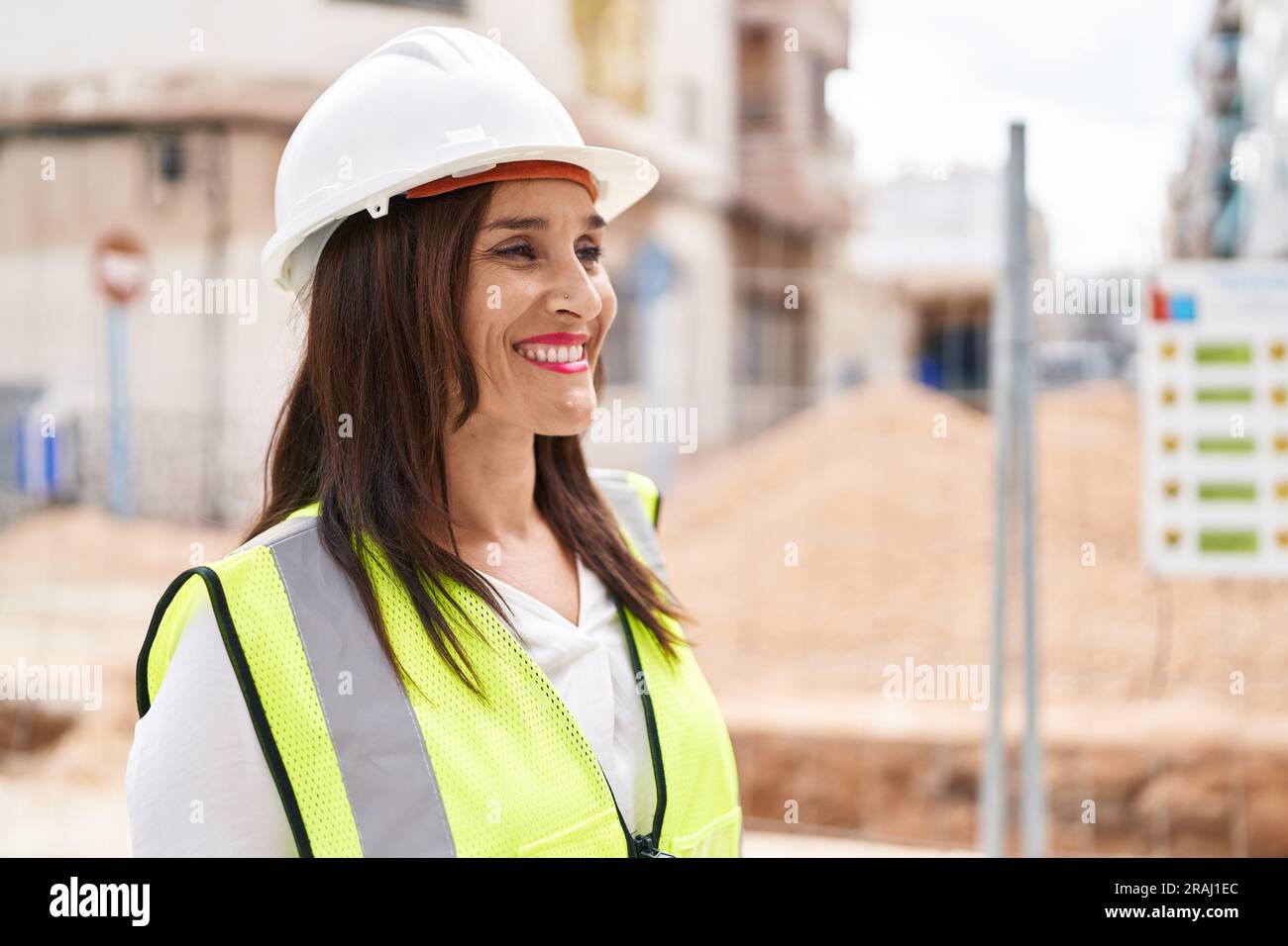 Young beautiful hispanic woman architect smiling confident standing at ...