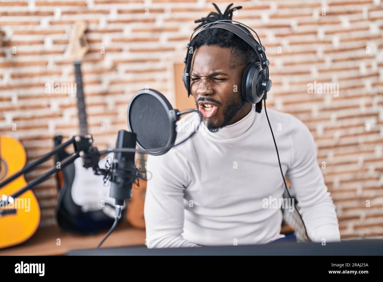 African american woman artist singing song at music studio Stock Photo ...
