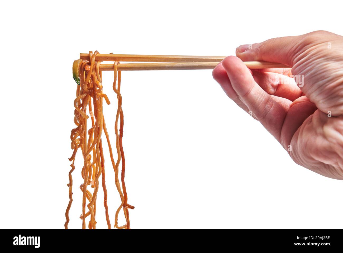 Hand of man holding thai noodles over isolated white background Stock ...